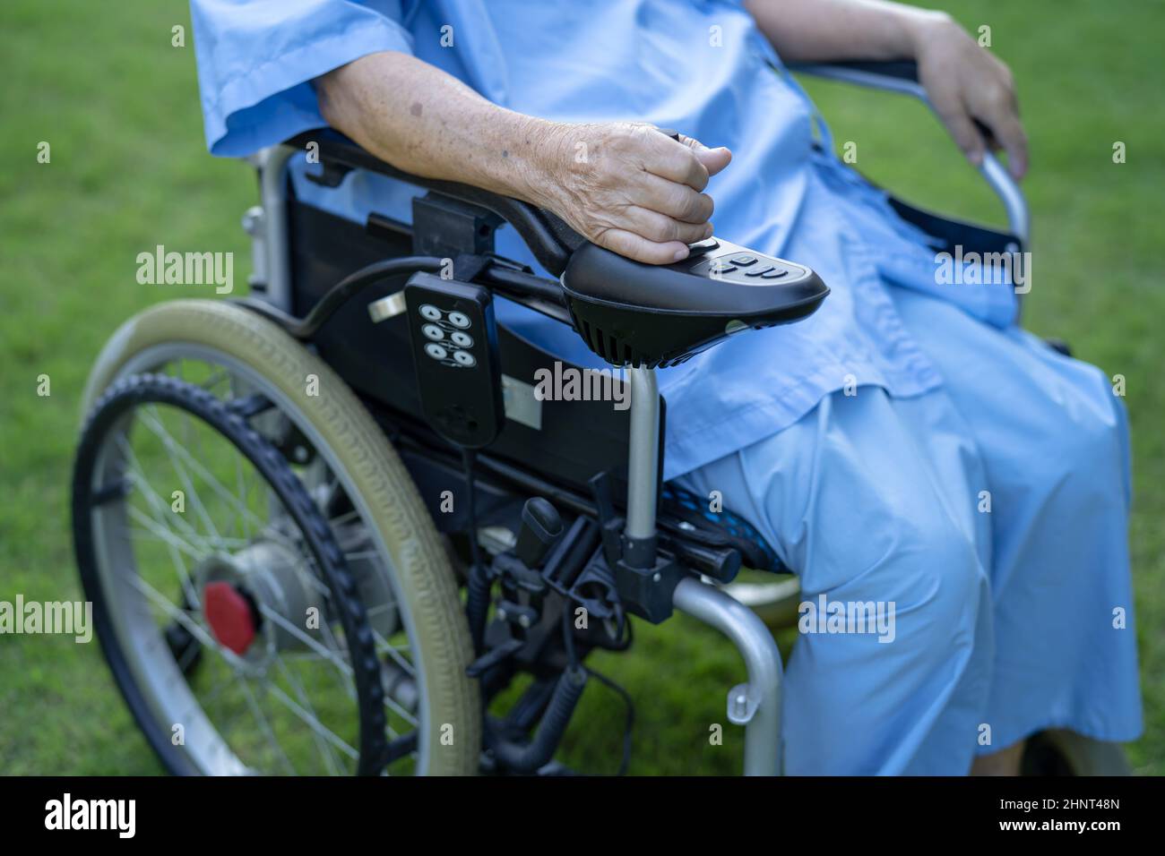 Asian senior or elderly old lady woman patient on electric wheelchair ...