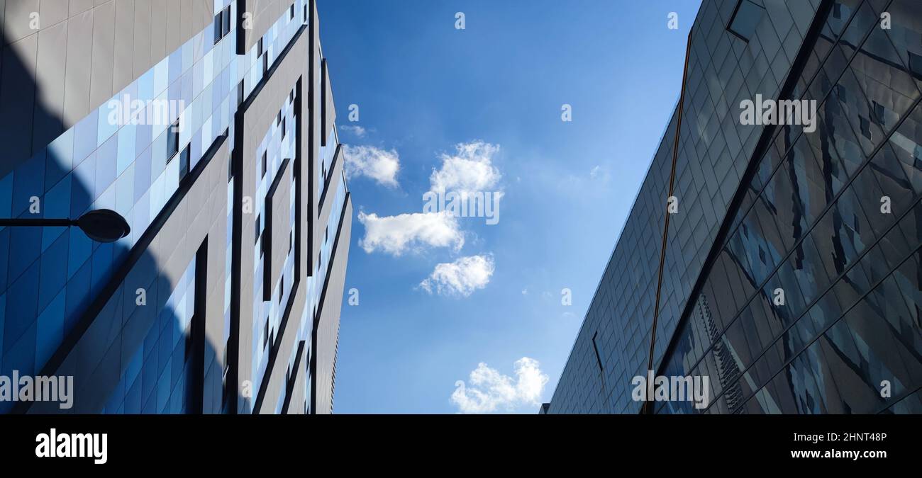 The Reflection of sky and could on modern commercial building Stock ...