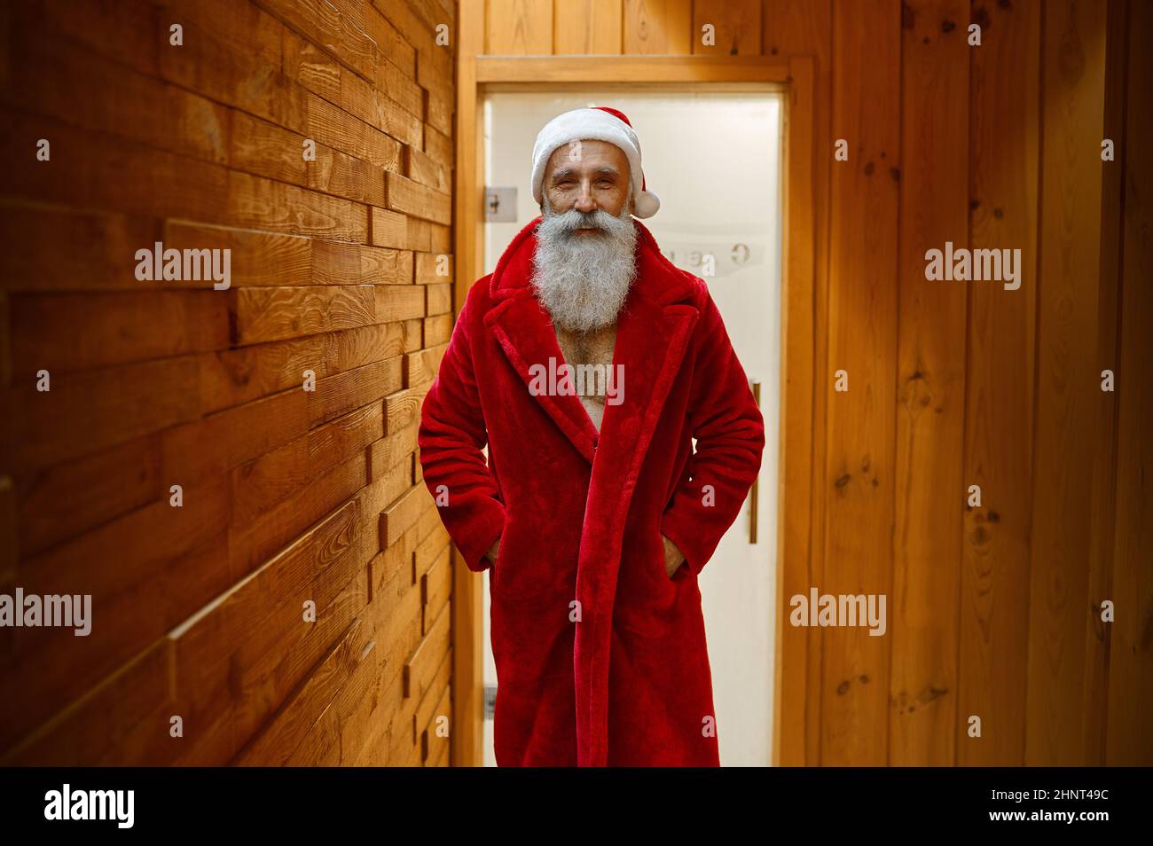 Santa Claus in red bathrobe in sauna Stock Photo - Alamy
