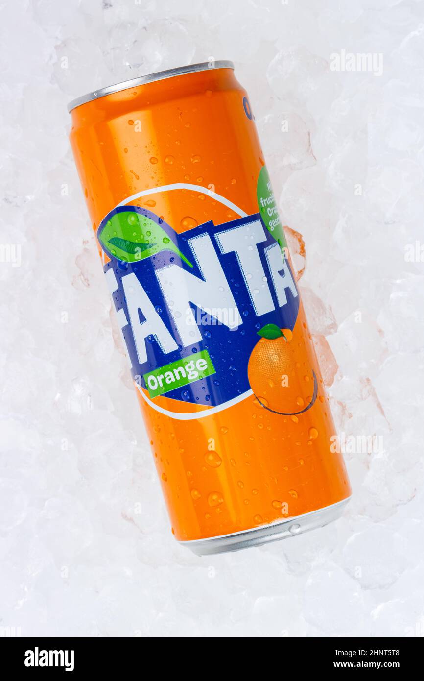 Fanta orange lemonade soft drink in a can on ice cubes portrait format Stock Photo - Alamy