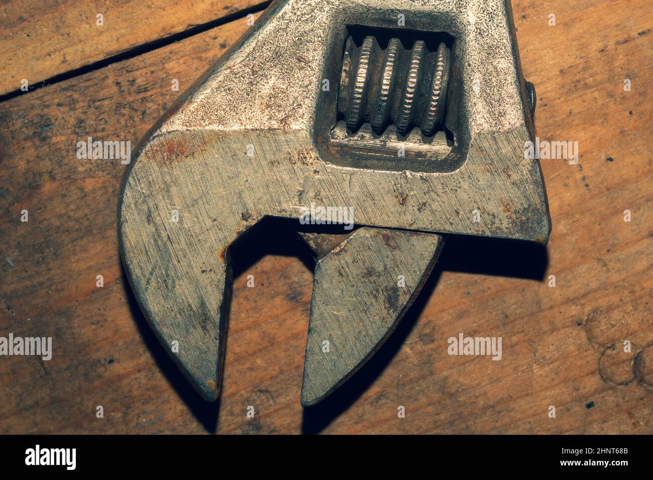 Old adjustable wrench on wood background. working tool. plumbing ...