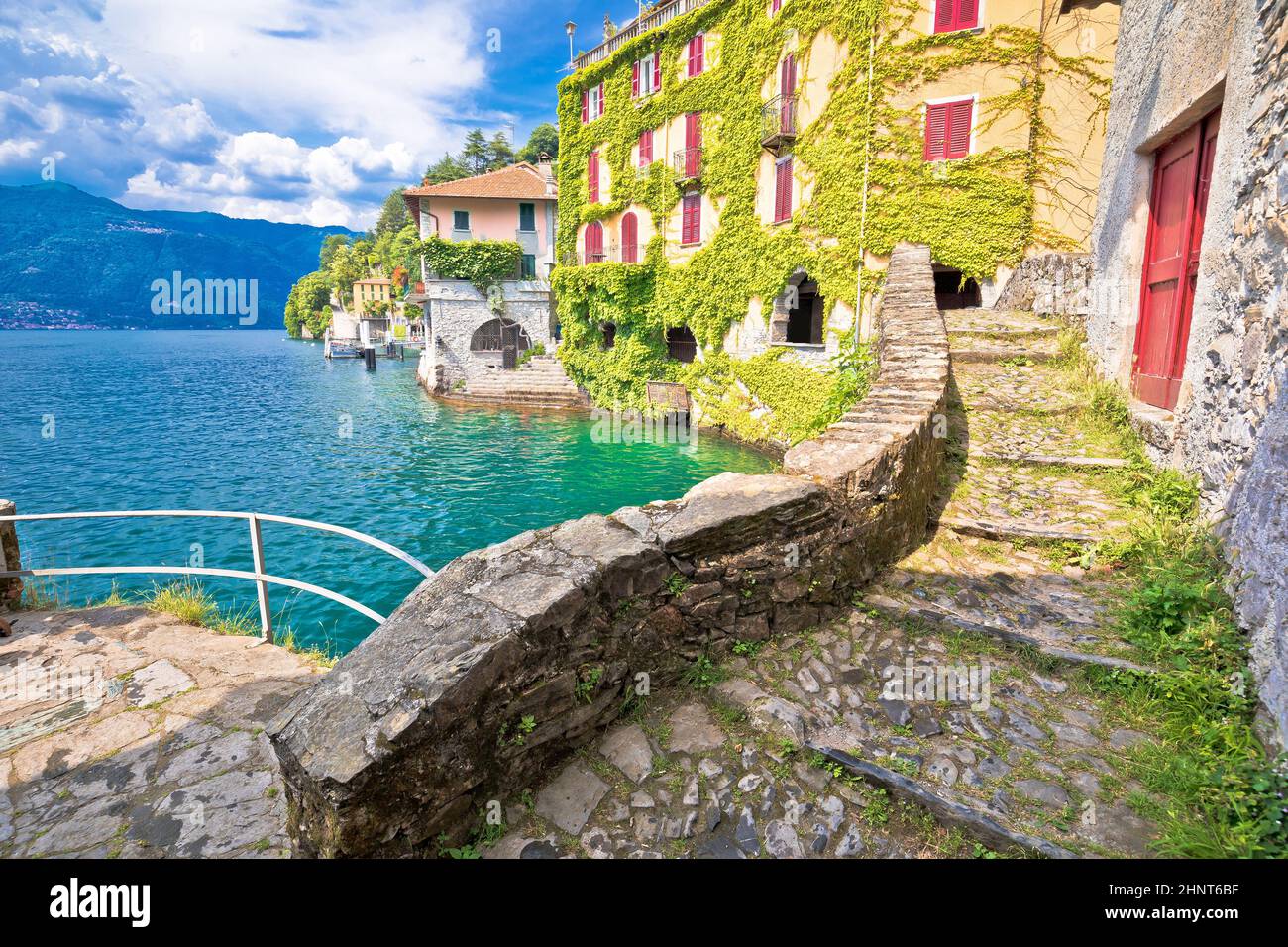 Town of Nesso historic stone bridge and scenic lakefront view, Como ...
