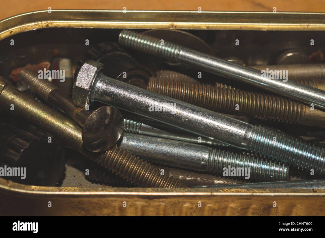 Old screws in a box. a lot of various screws. pile of fasteners in the ...