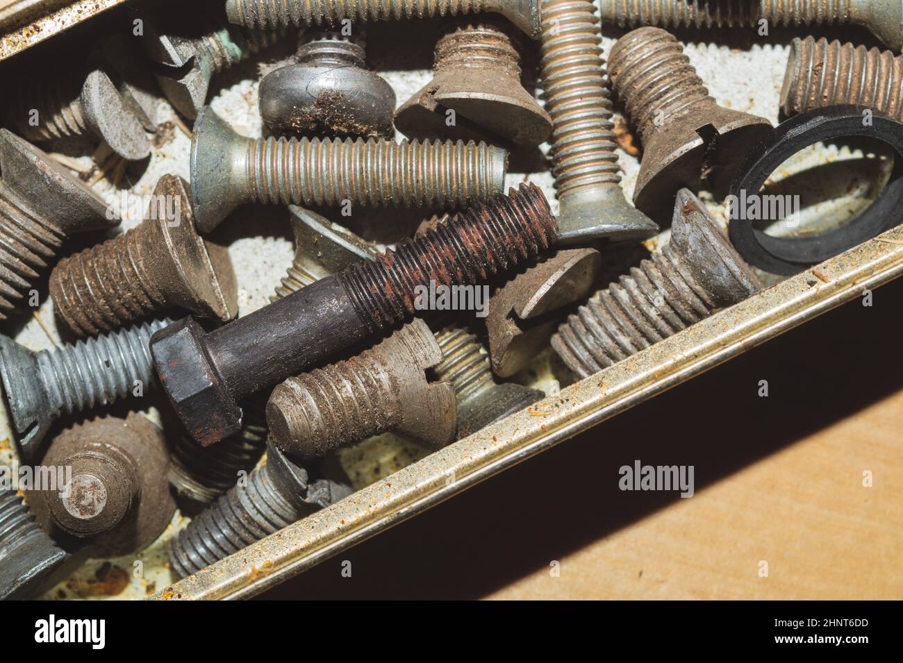 Old screws in a box. a lot of various screws. pile of fasteners in the ...