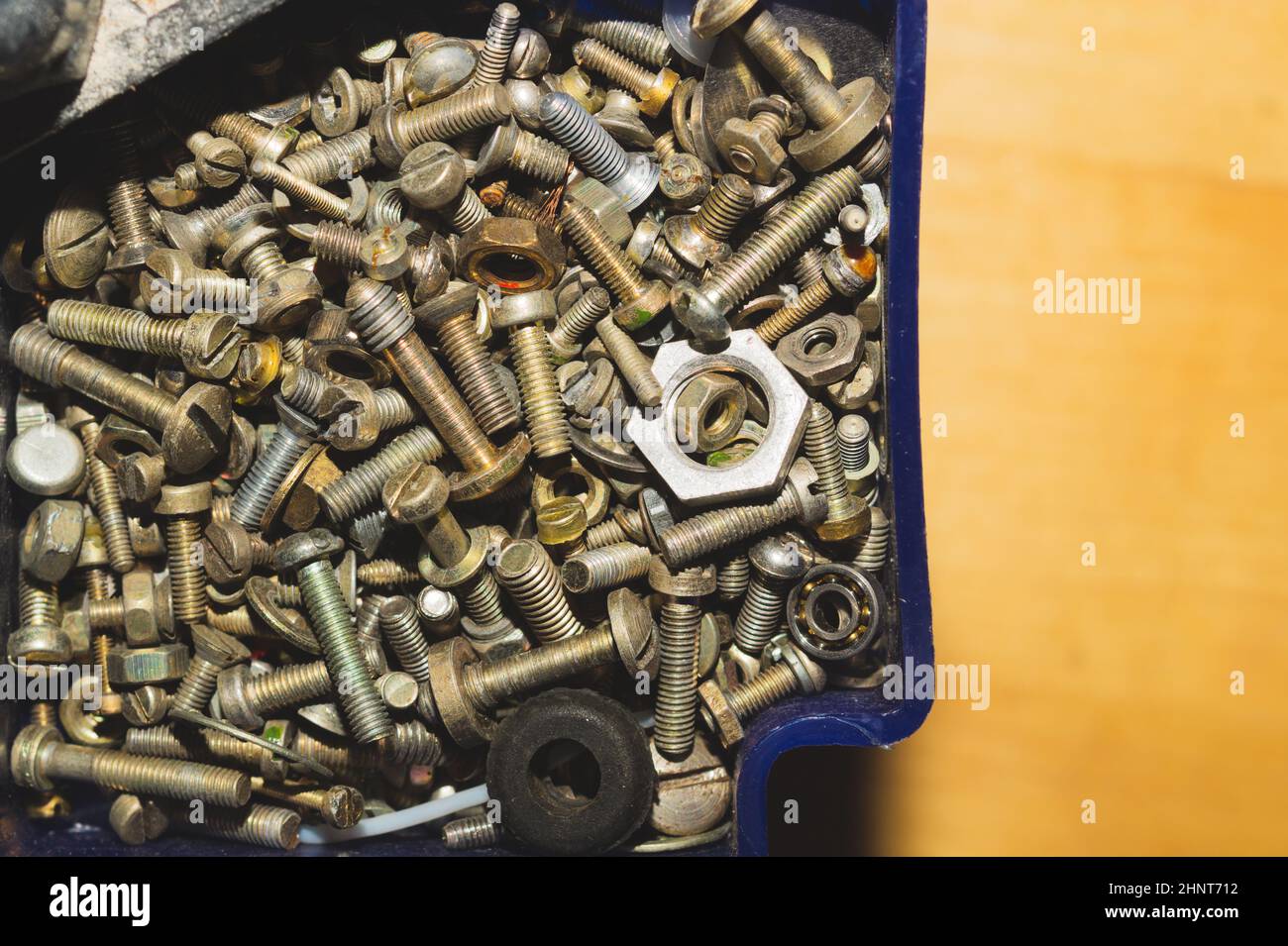 Old screws in a box. a lot of various screws. pile of fasteners in the ...