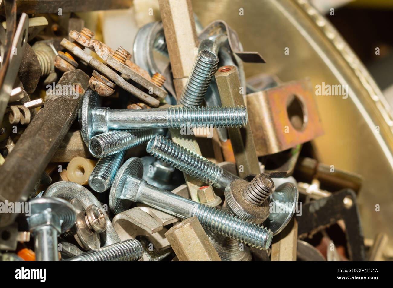 Old screws in a box. a lot of various screws. pile of fasteners in the ...