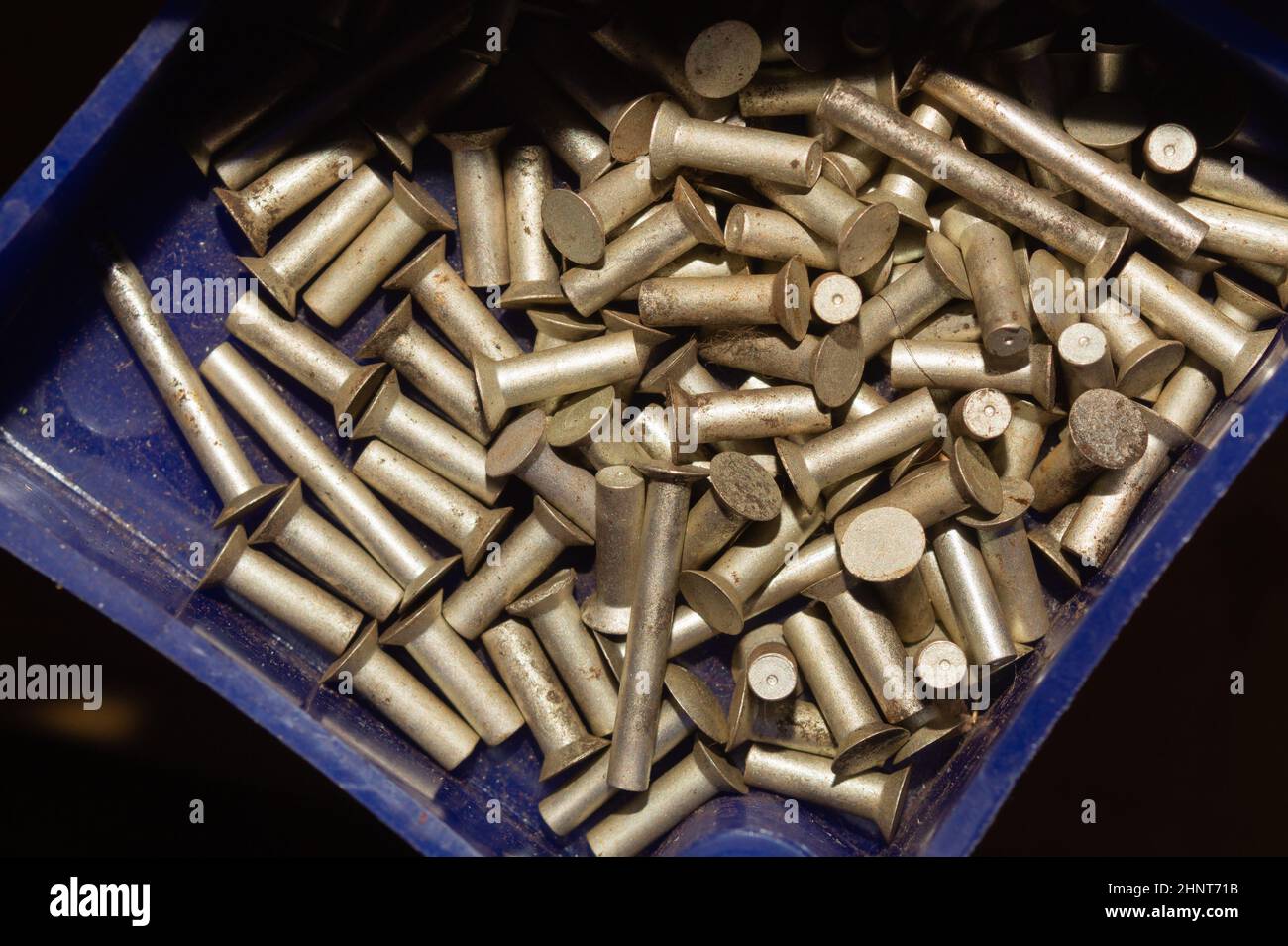Old screws in a box. a lot of various screws. pile of fasteners in the ...
