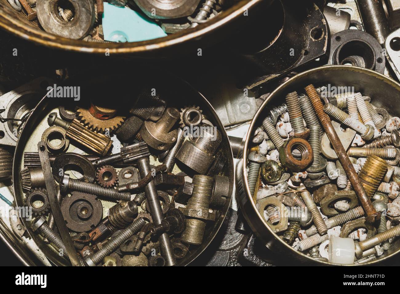 Old screws in a box. a lot of various screws. pile of fasteners in the ...