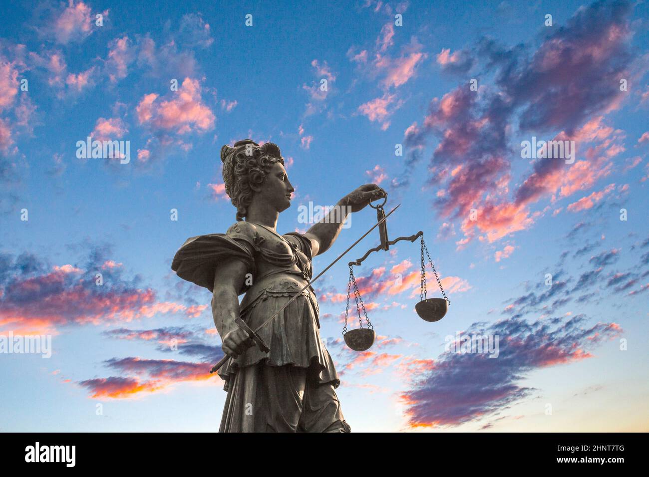 Statue of Lady Justice in front of the Romer in Frankfurt with dramatic ...