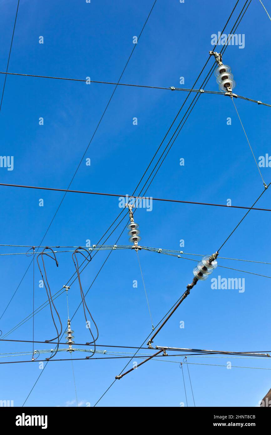 catenary of train under clear blue sky Stock Photo - Alamy