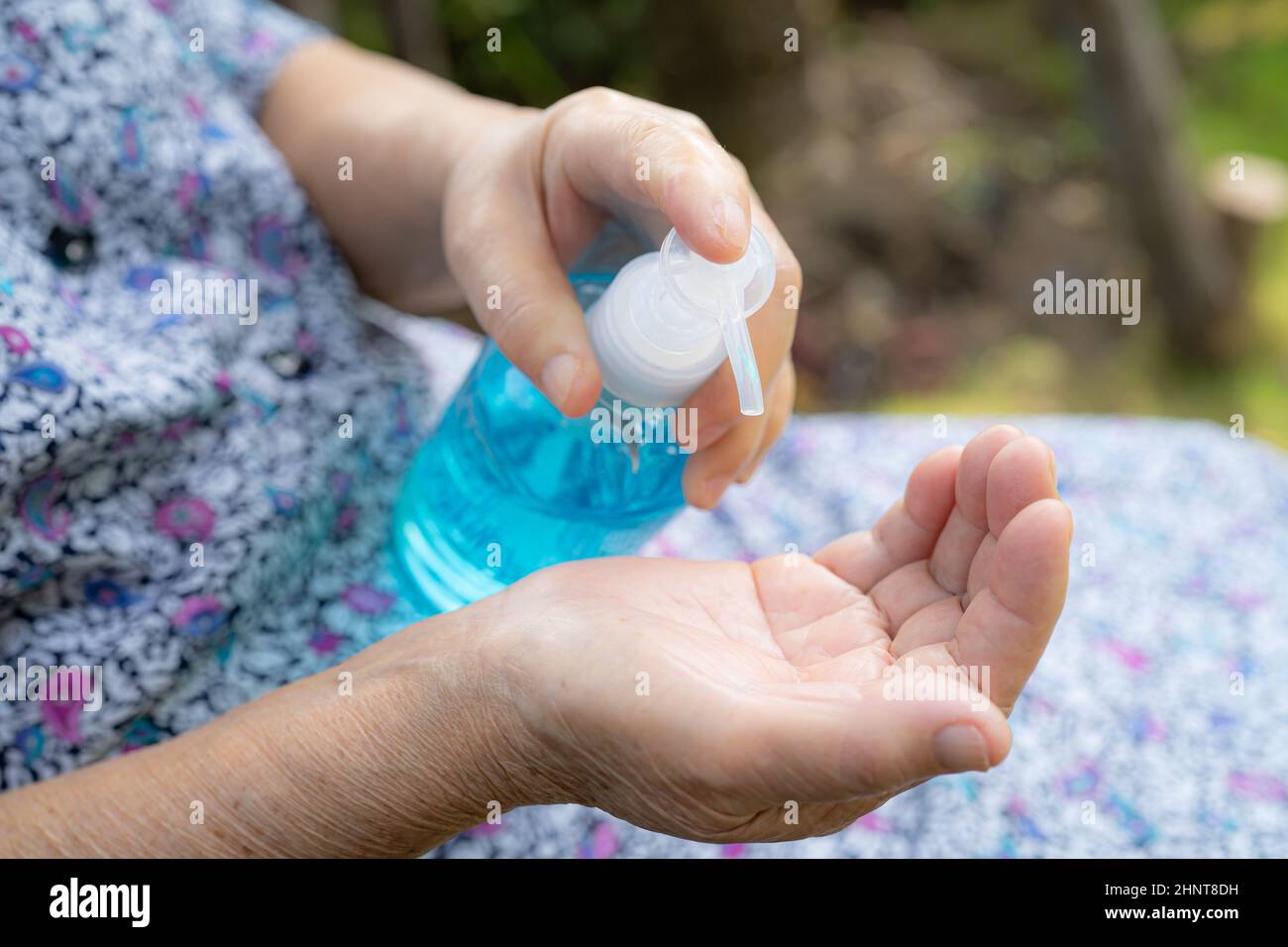 Asian senior or elderly old lady woman patient washing hand with blue ...