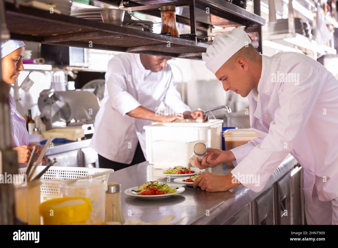 Professional responsible chef working in restaurant kitchen Stock Photo ...