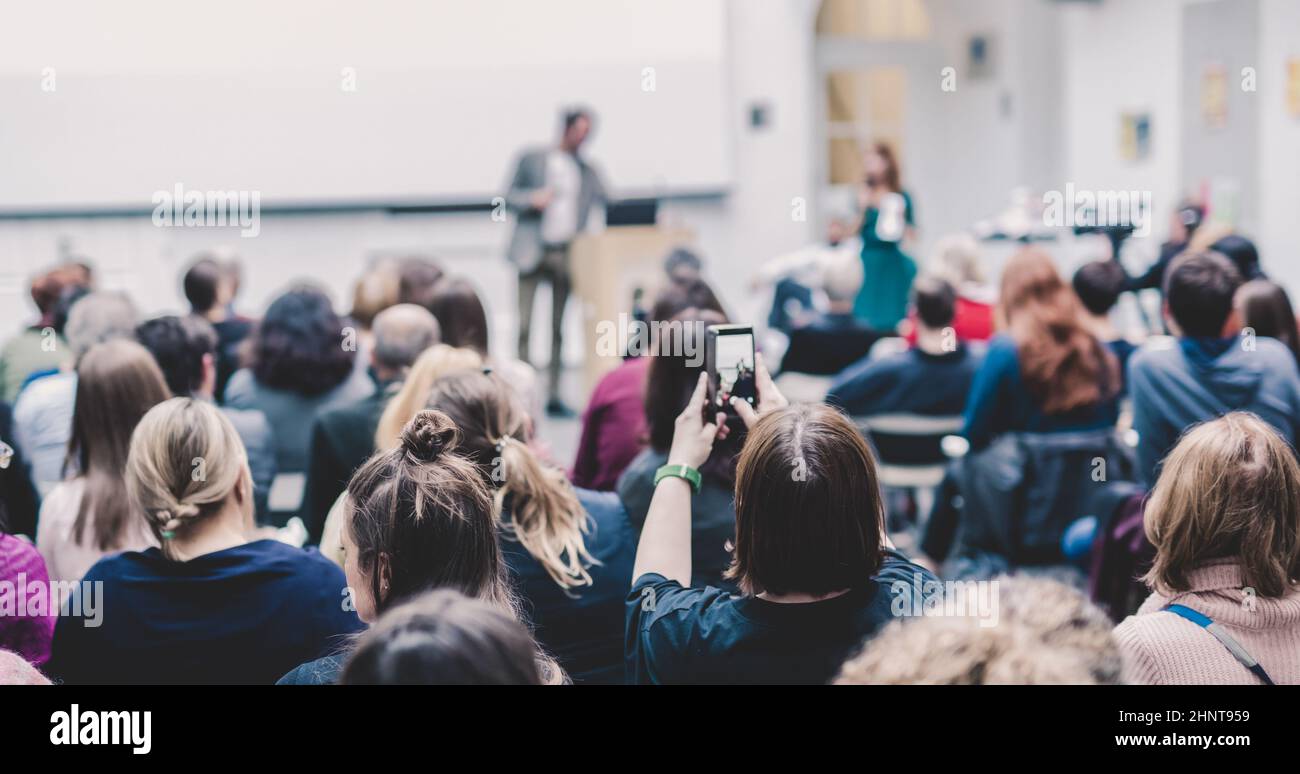 Man giving presentation in lecture hall at university Stock Photo - Alamy