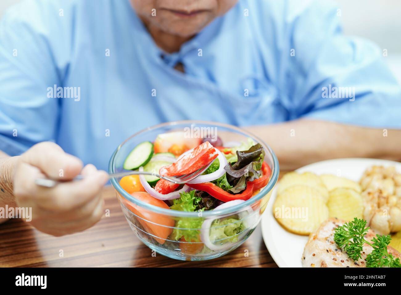 Asian senior or elderly old lady woman patient eating breakfast ...