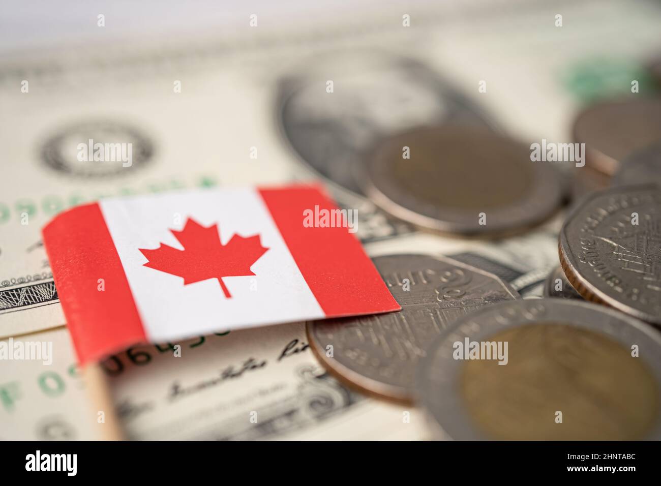 Canada flag on coins and banknotes background, finance and accounting ...