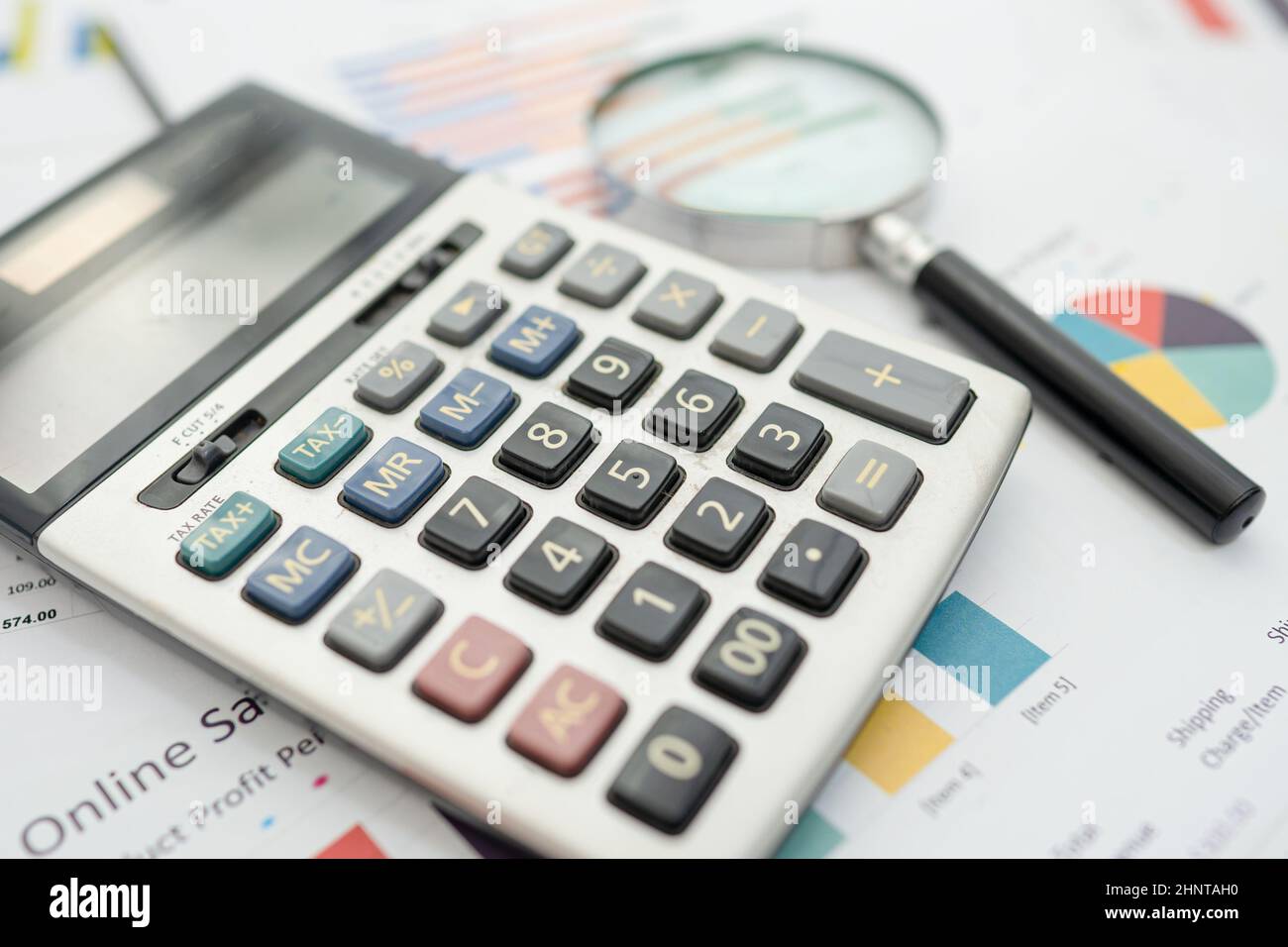 Calculator on chart and graph paper. Finance development, Banking ...