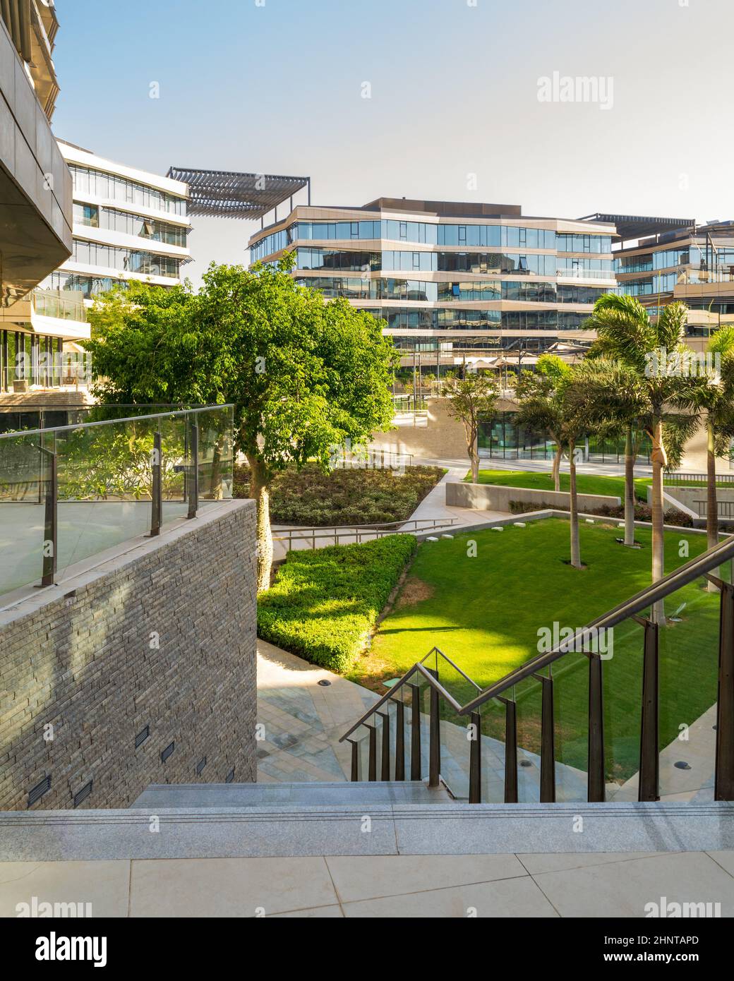 Marble staircase and glass handrail in modern urban city district with ...