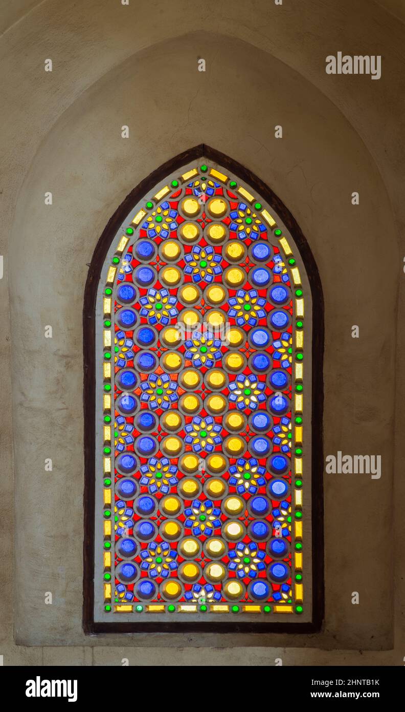 Mamluk era perforated stucco window with colorful stain glass with ...