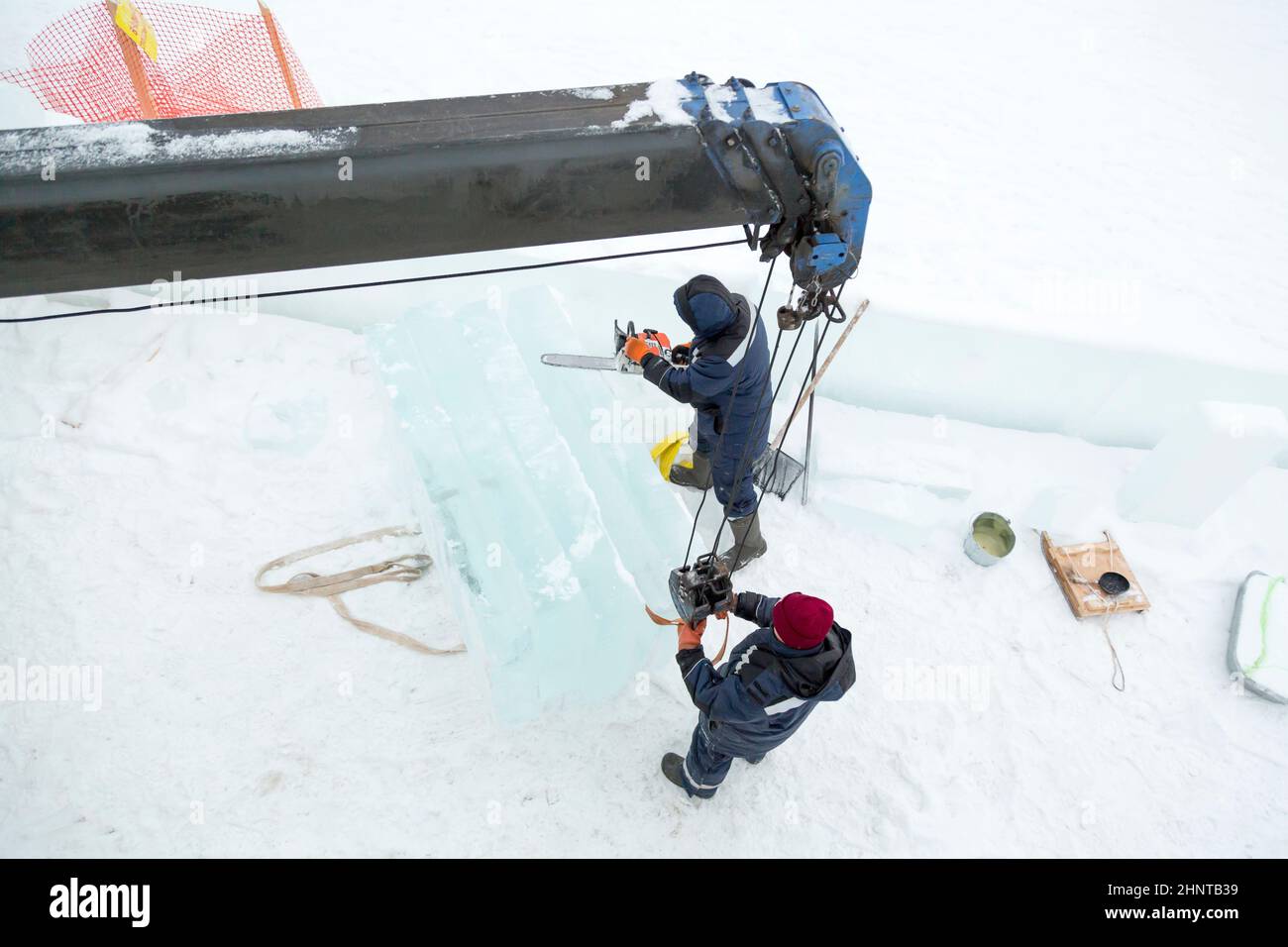 The fitter cuts the ice panel with a petrol saw Stock Photo - Alamy
