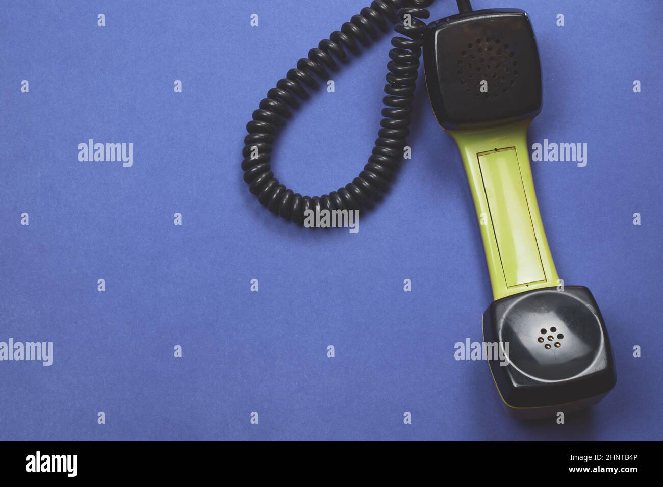 Telephone handset. phone receiver on blue background. old communication ...