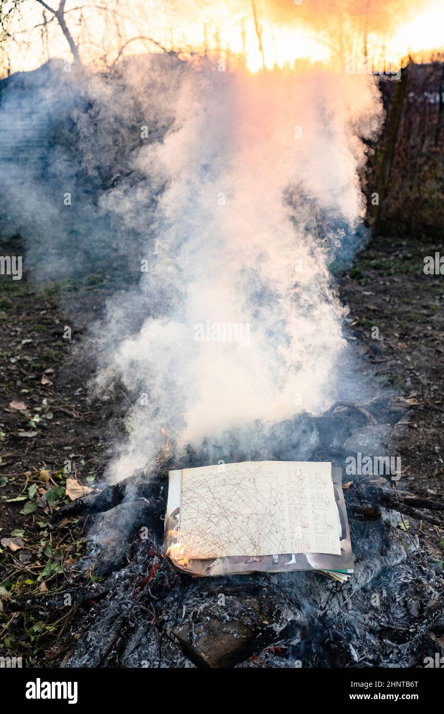 vintage fashion magazine burning in fire on ash Stock Photo - Alamy