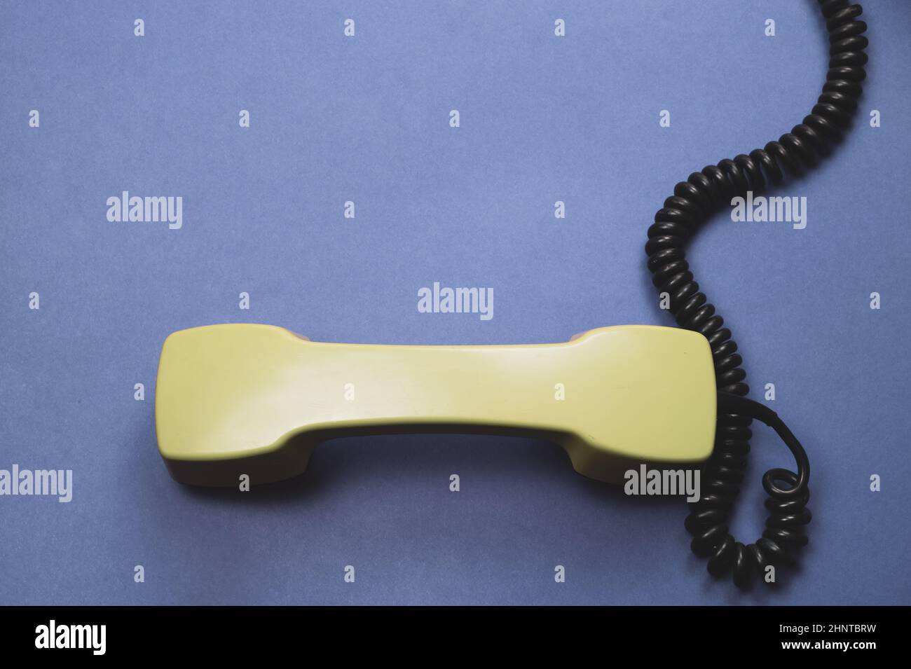 Telephone handset. phone receiver on blue background. old communication ...