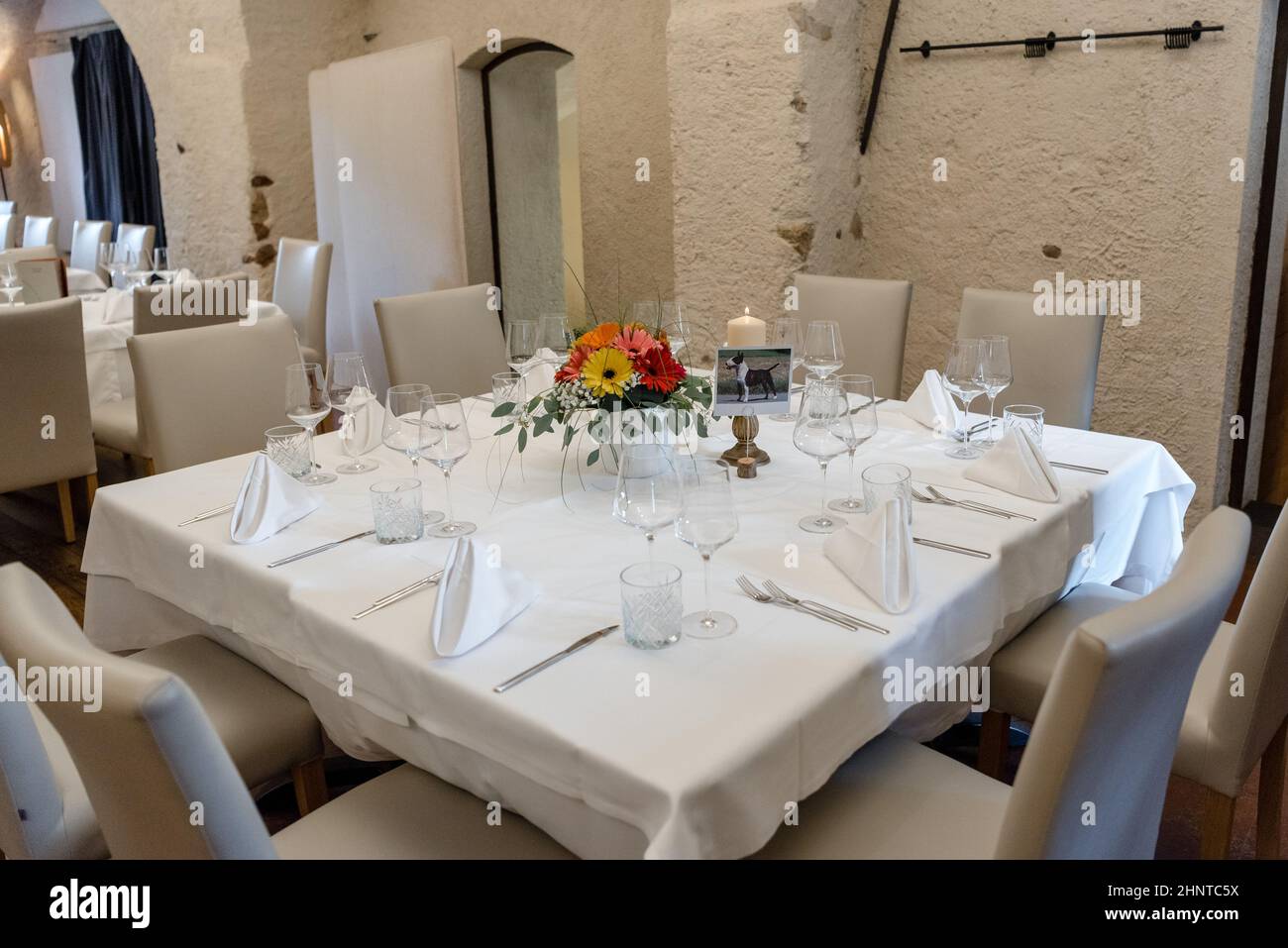 Banquet hall table decorated with flowers Stock Photo - Alamy
