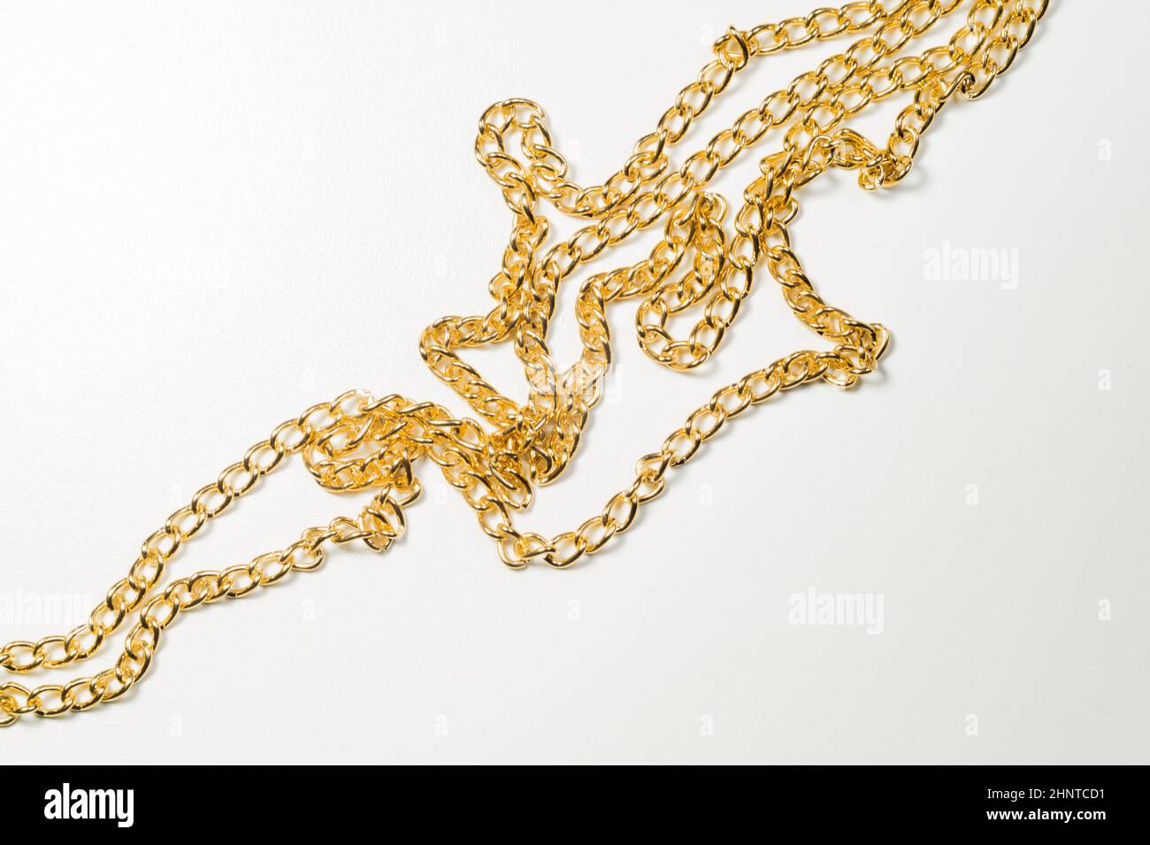 Golden chain isolated on white background Stock Photo - Alamy