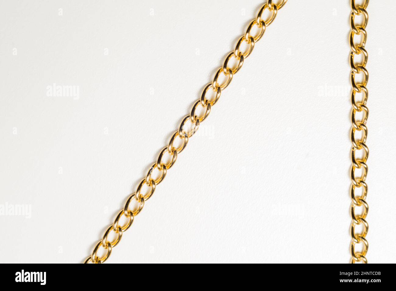 Golden chain isolated on white background Stock Photo - Alamy