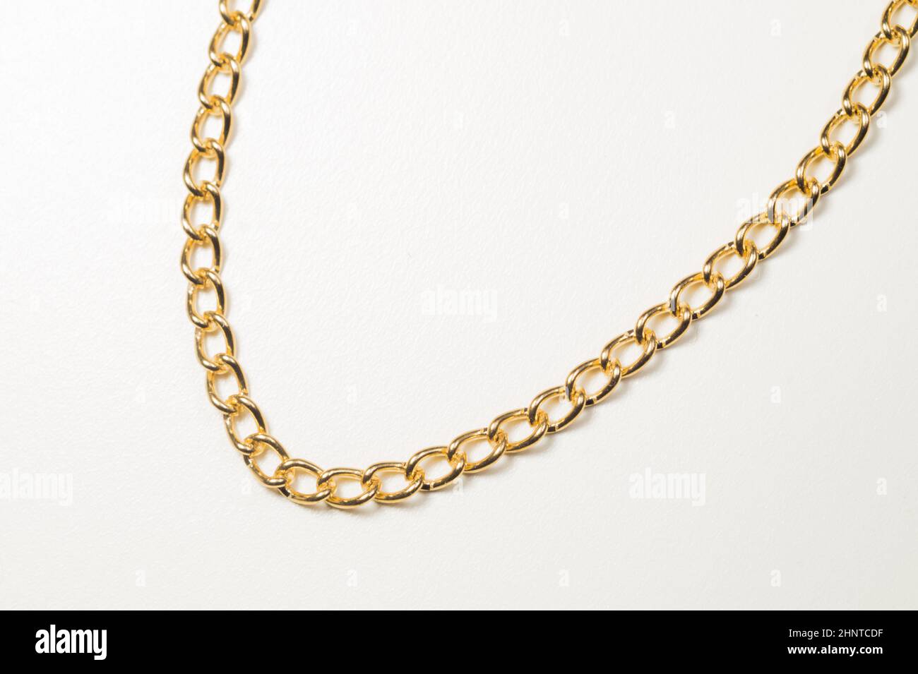 Golden chain isolated on white background Stock Photo - Alamy