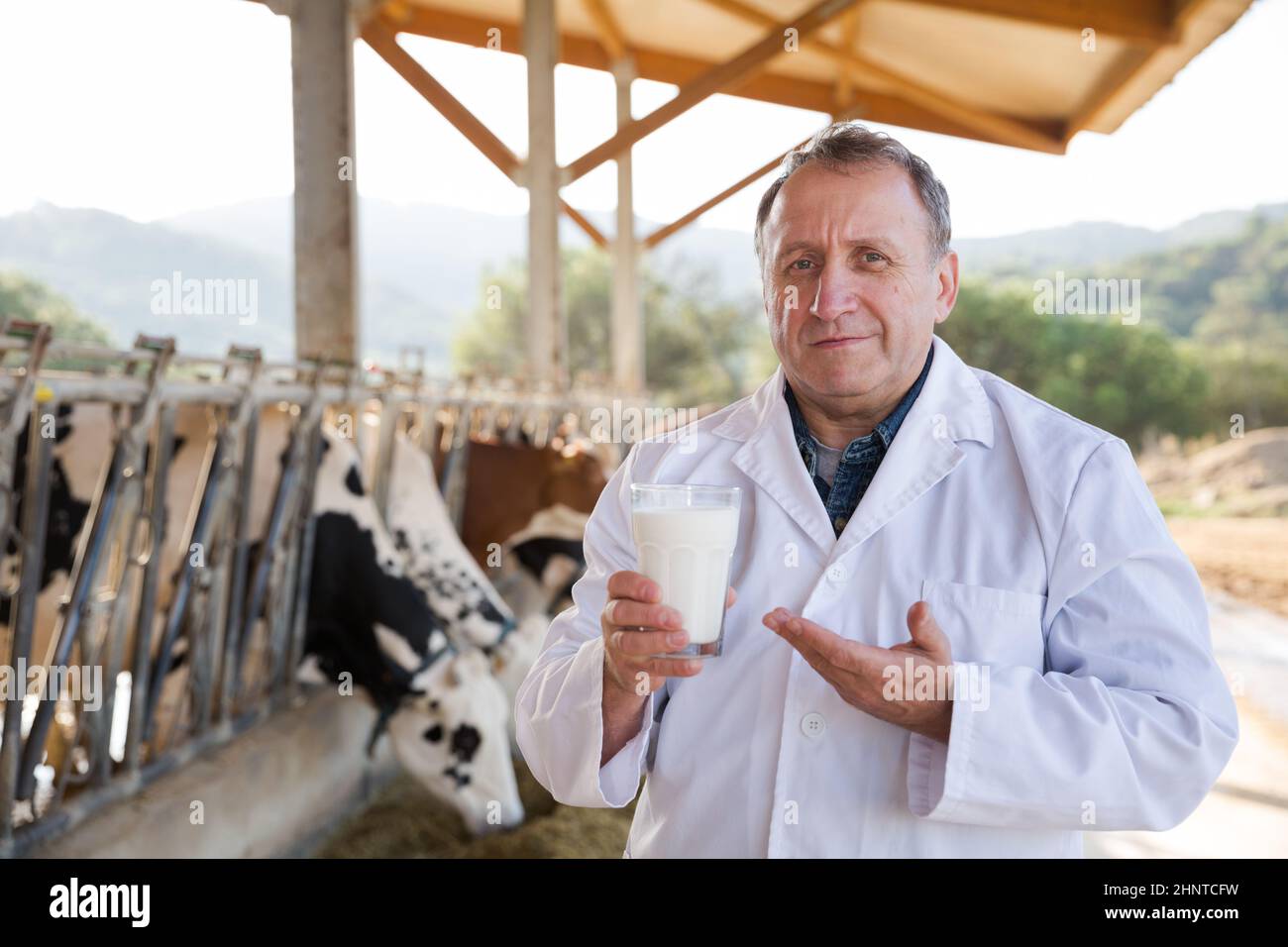 Male quality expert is standing in uniform Stock Photo - Alamy