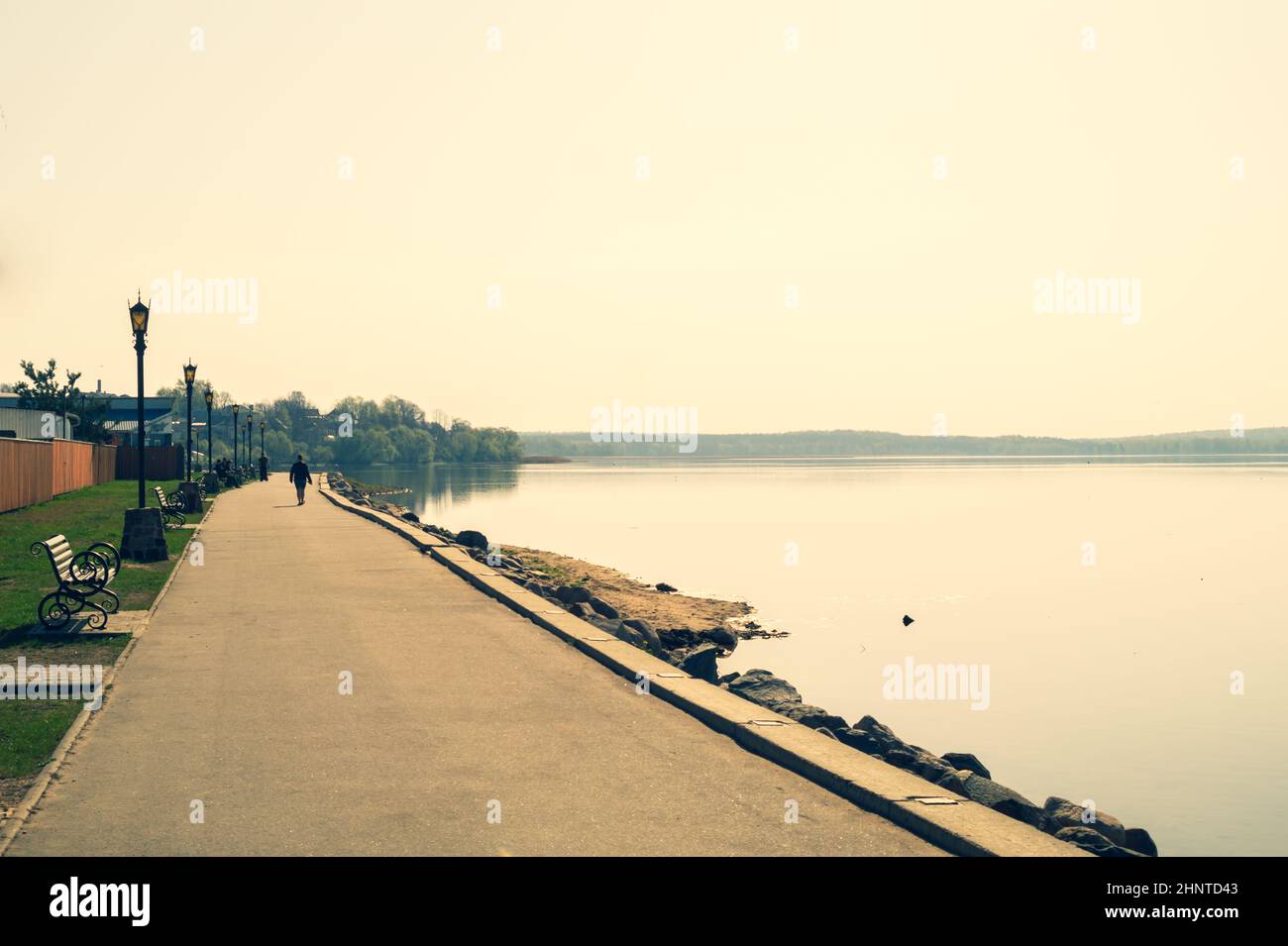 Man walking on pathway lake hi-res stock photography and images - Alamy