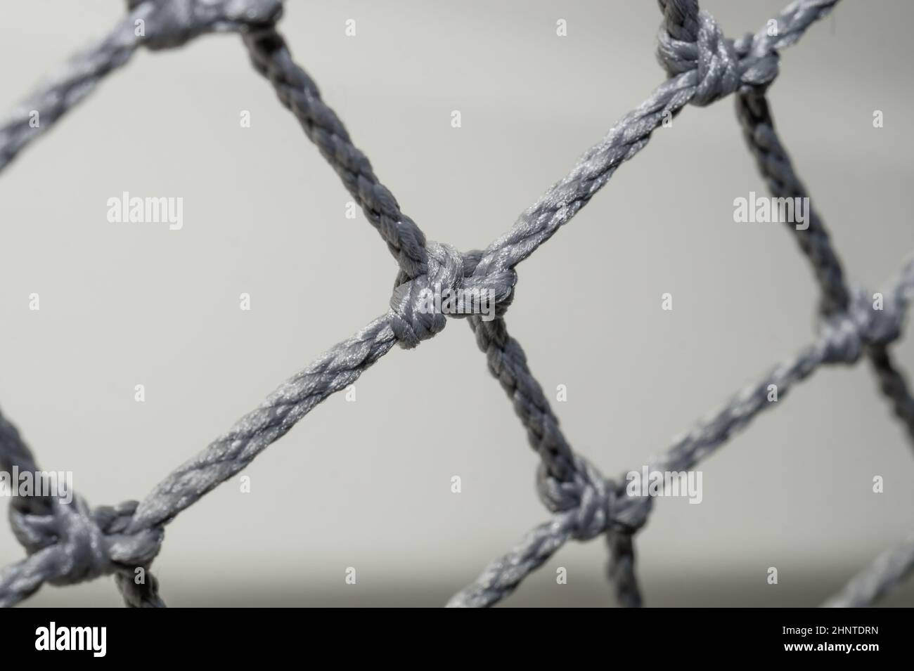Rope net close up. mesh with knots and weaving Stock Photo - Alamy