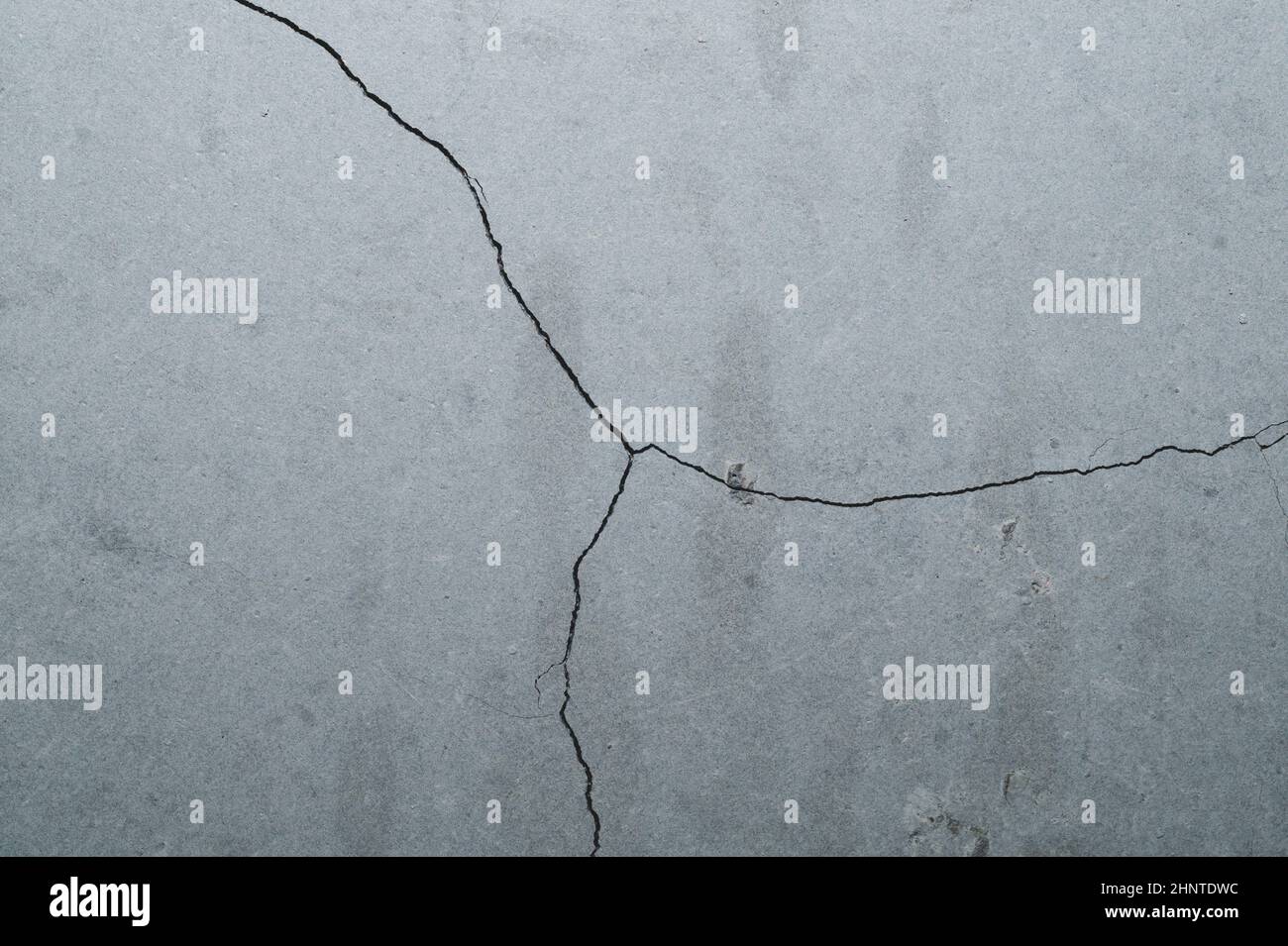 Concrete wall with cracks and scratches. abstract gray background with ...