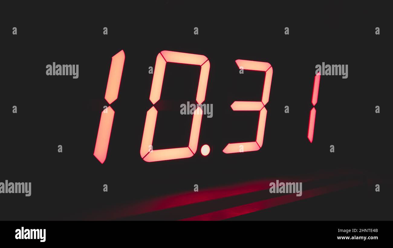 Digital clock with red led light illumination numbers in the dark ...