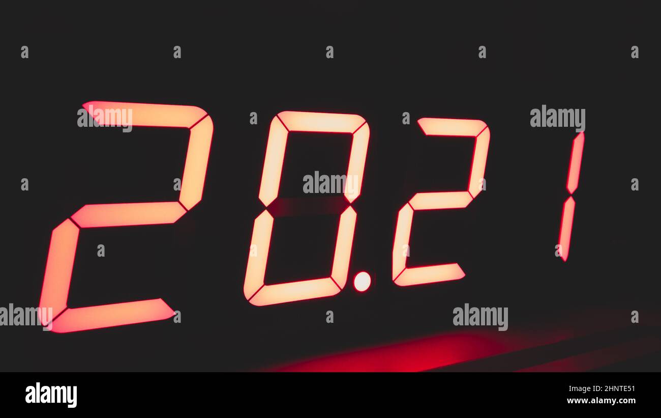 Digital clock with red led light illumination numbers 2021 in the dark ...