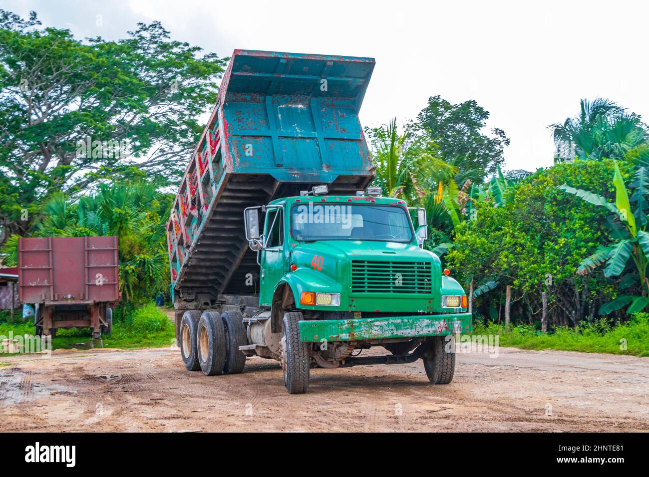 Dump tipper truck on in the jungle tropical nature Mexico Stock Photo ...