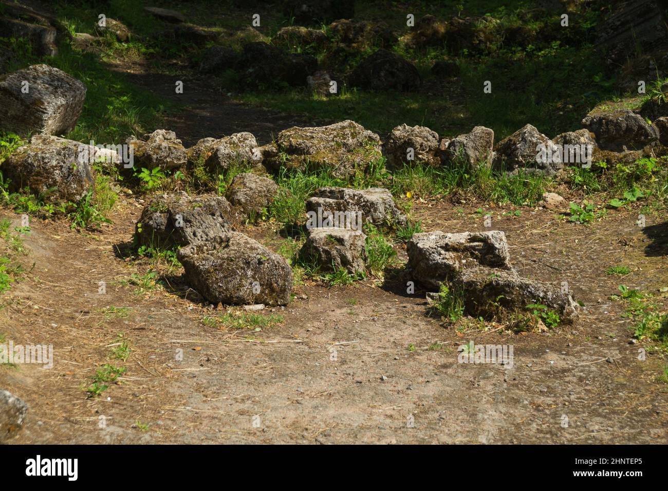 Old stone ruins in the summer forest background Stock Photo - Alamy
