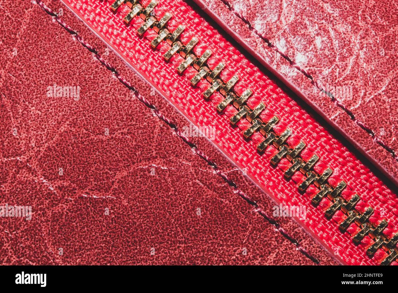 Red leather texture with zipper closure. material with seams macro ...