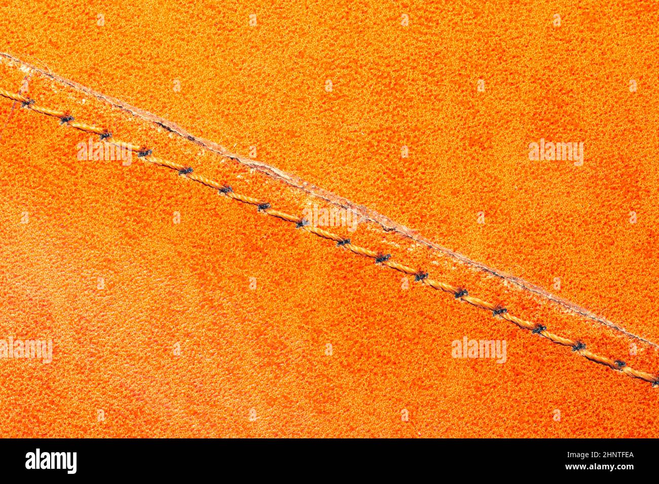 Brown leather texture with a linear stitch. material with seam Stock ...