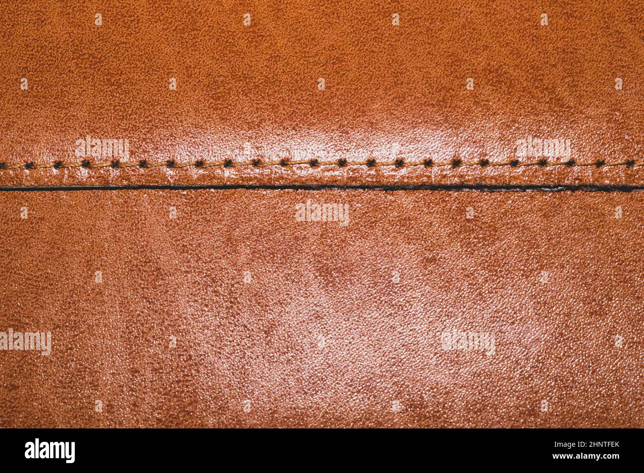 Brown leather texture with a linear stitch. material with seam Stock ...
