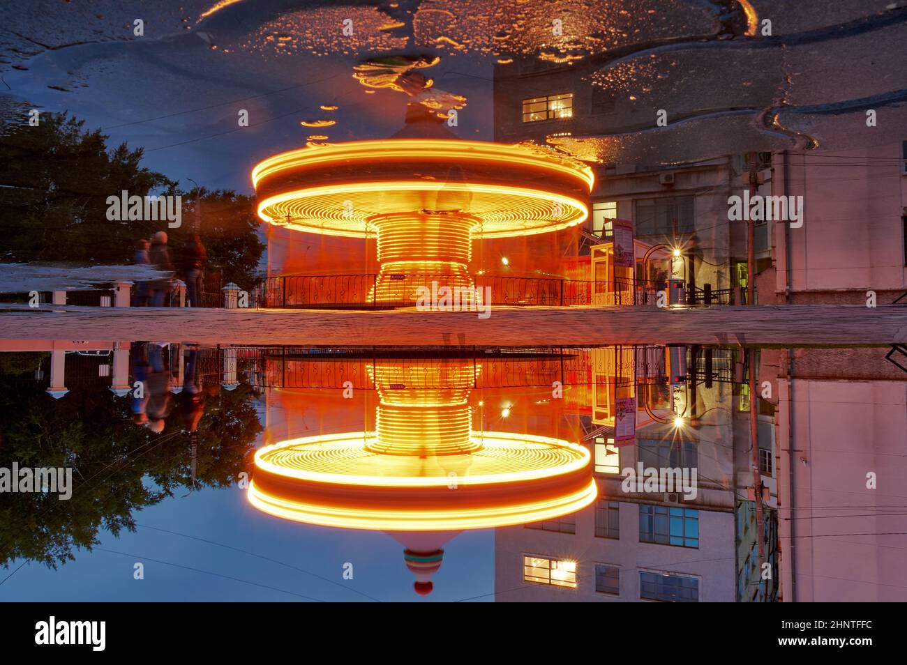 Amusement Park in the evening with lights on Stock Photo - Alamy