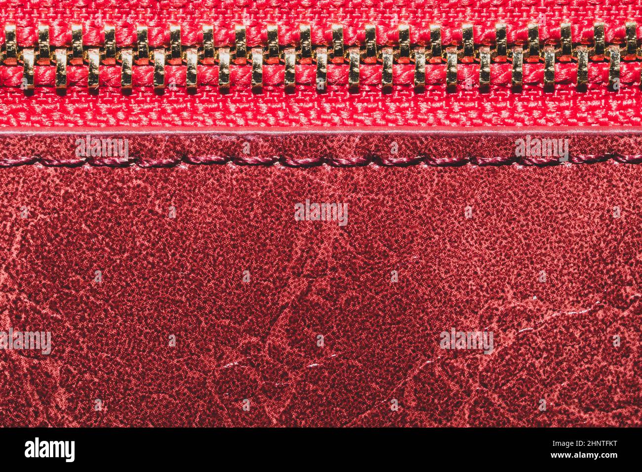 Red leather texture with zipper closure. material with seams macro ...