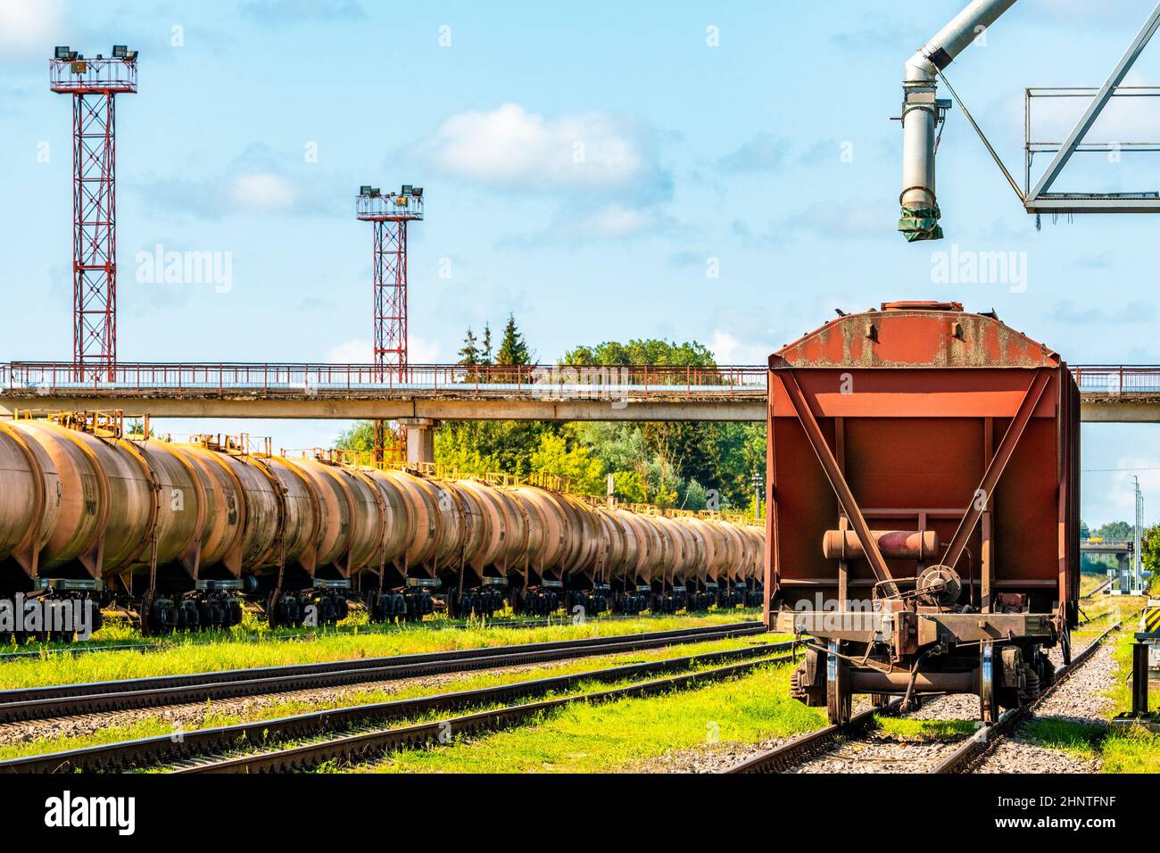 Loading railway wagon standing near the elevator in agriculture zone ...