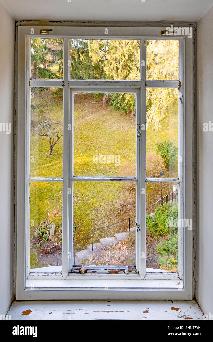 old historic window with garden view of an old historic house Stock ...