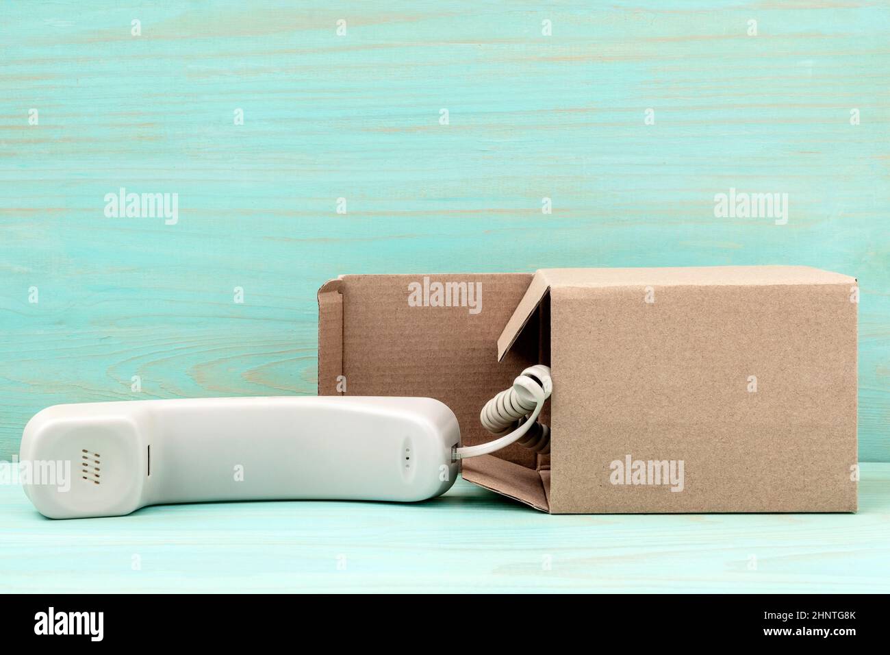 Surprise call inside a cardboard box. Old telephone receiver in ...
