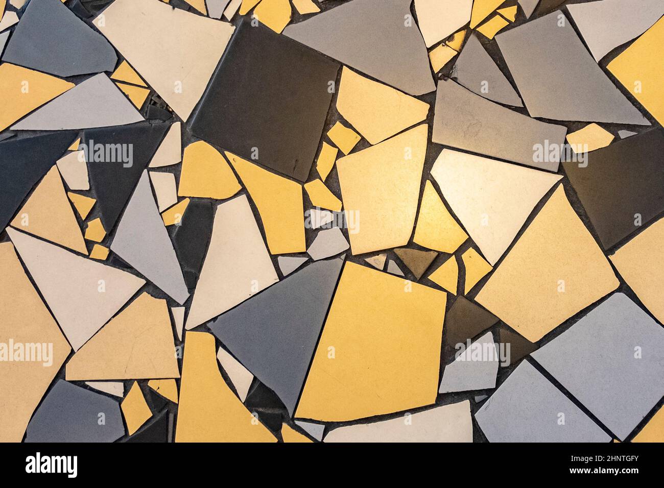 pattern of irregular tiles at the floor gives a harmonic mosaic ...