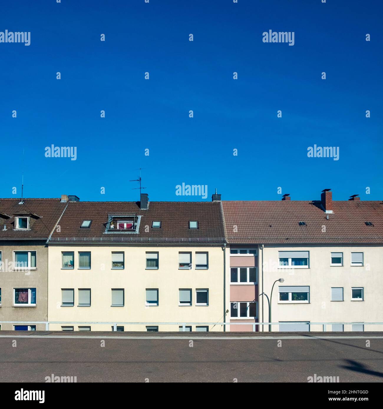 typical facade of living area with blue sky as symbol for living Stock ...