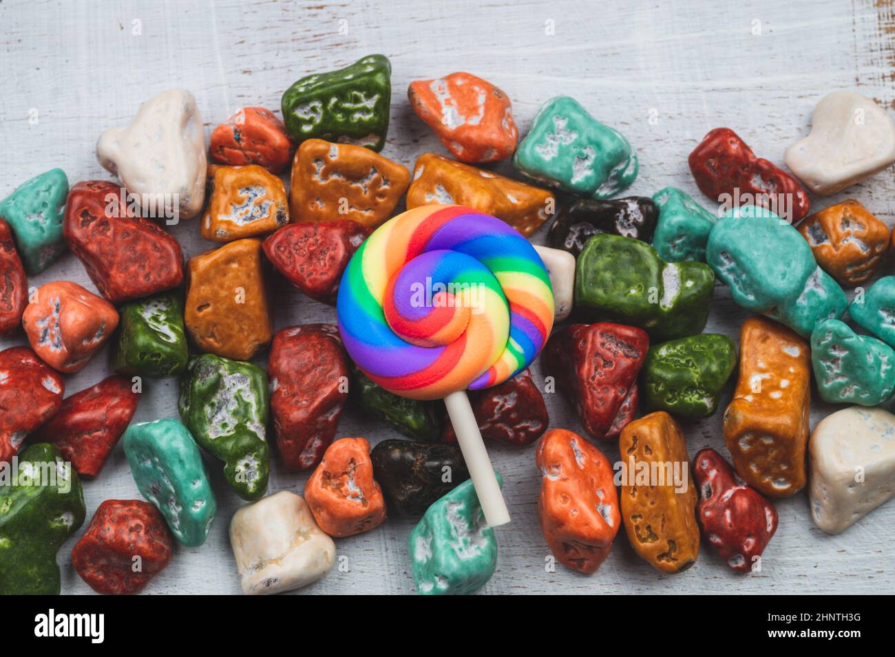 Festive decoration. lollipop and candy pebbles. sweets in the form of ...