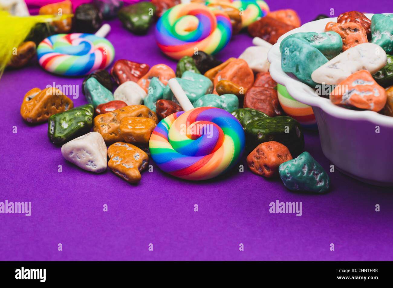 Lollipops and candy pebbles. sweets in the form of colored stones ...